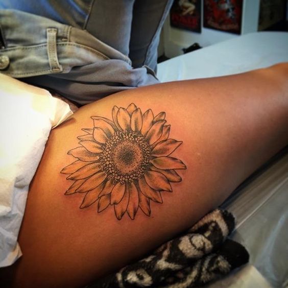 Why Not Be Glamorous And Powerful With Sunflower Thigh Tattoo